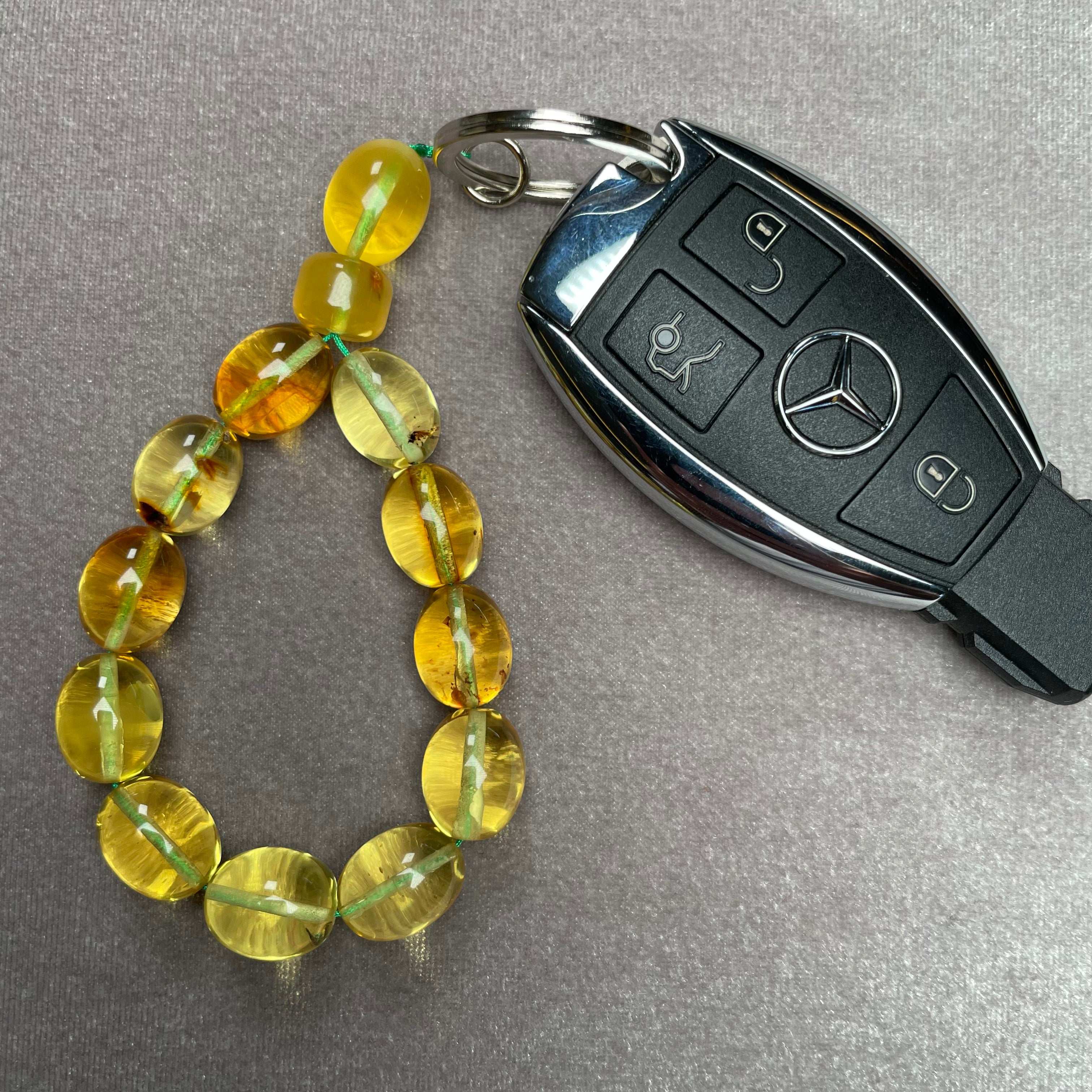 TRANSPARENT AMBER KEYCHAIN 10,8x13,6mm 14,4g – ambersmilerosaries