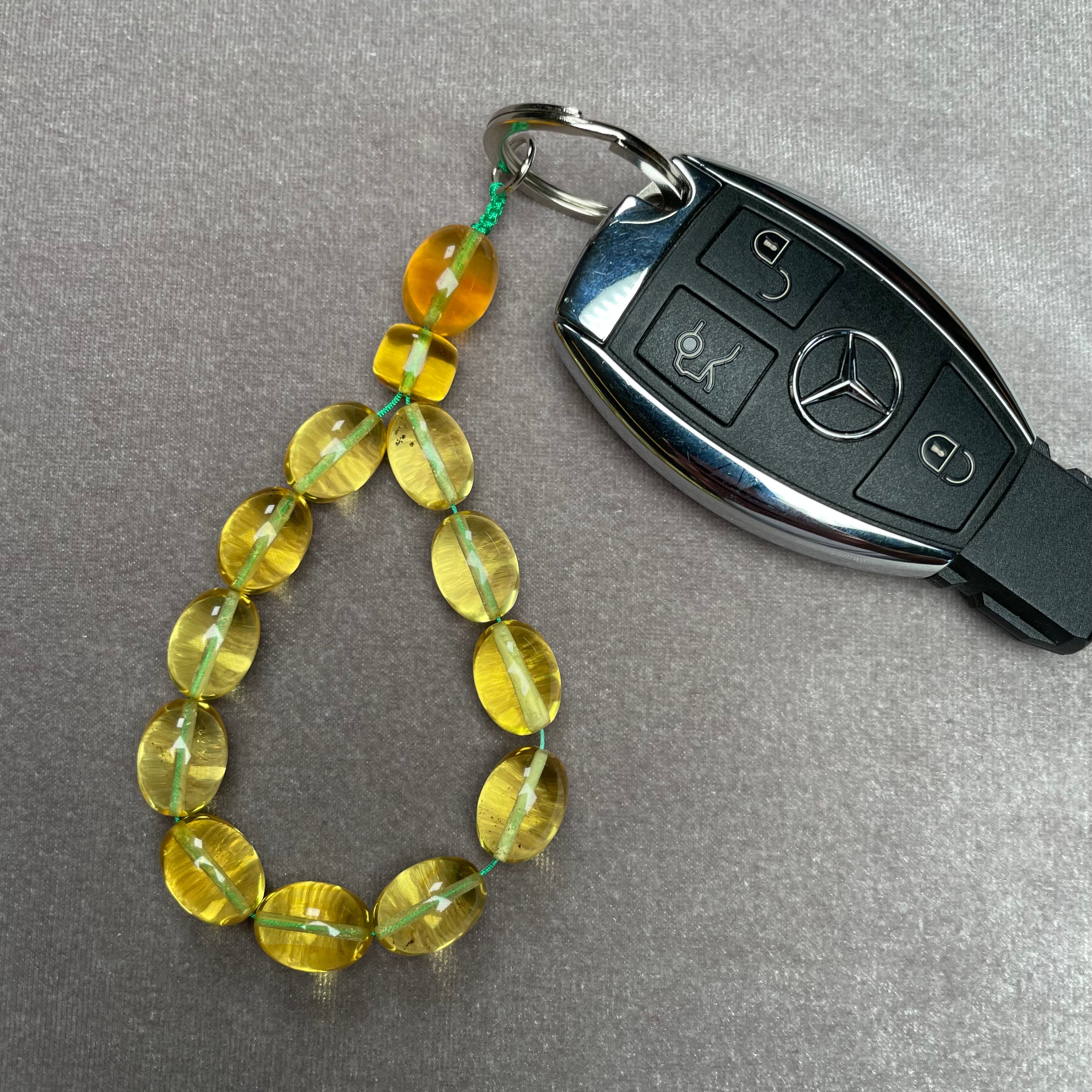 TRANSPARENT AMBER KEYCHAIN 10x13,6mm 12,7g – ambersmilerosaries